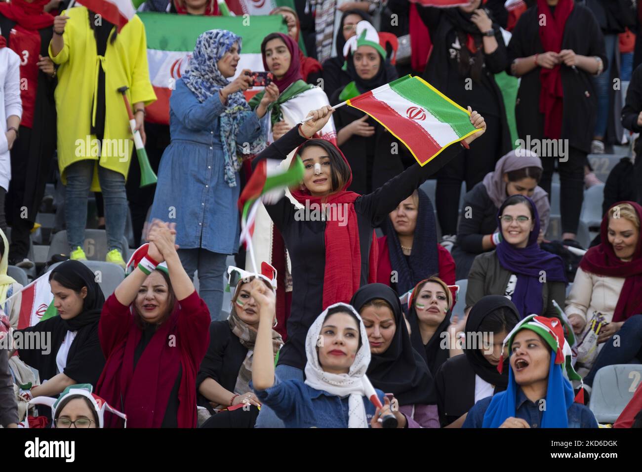 An Iranian soccer female fan waves an Iran flag at the Azadi (Freedom ...