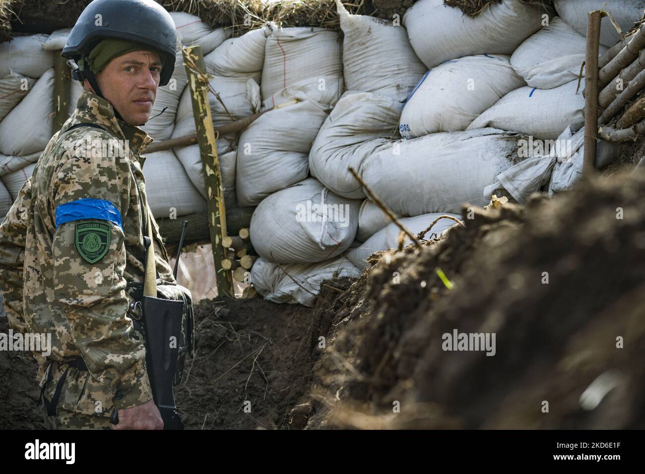 A ukrainian soldier at his lookout in the trenches in the outskirts of ...