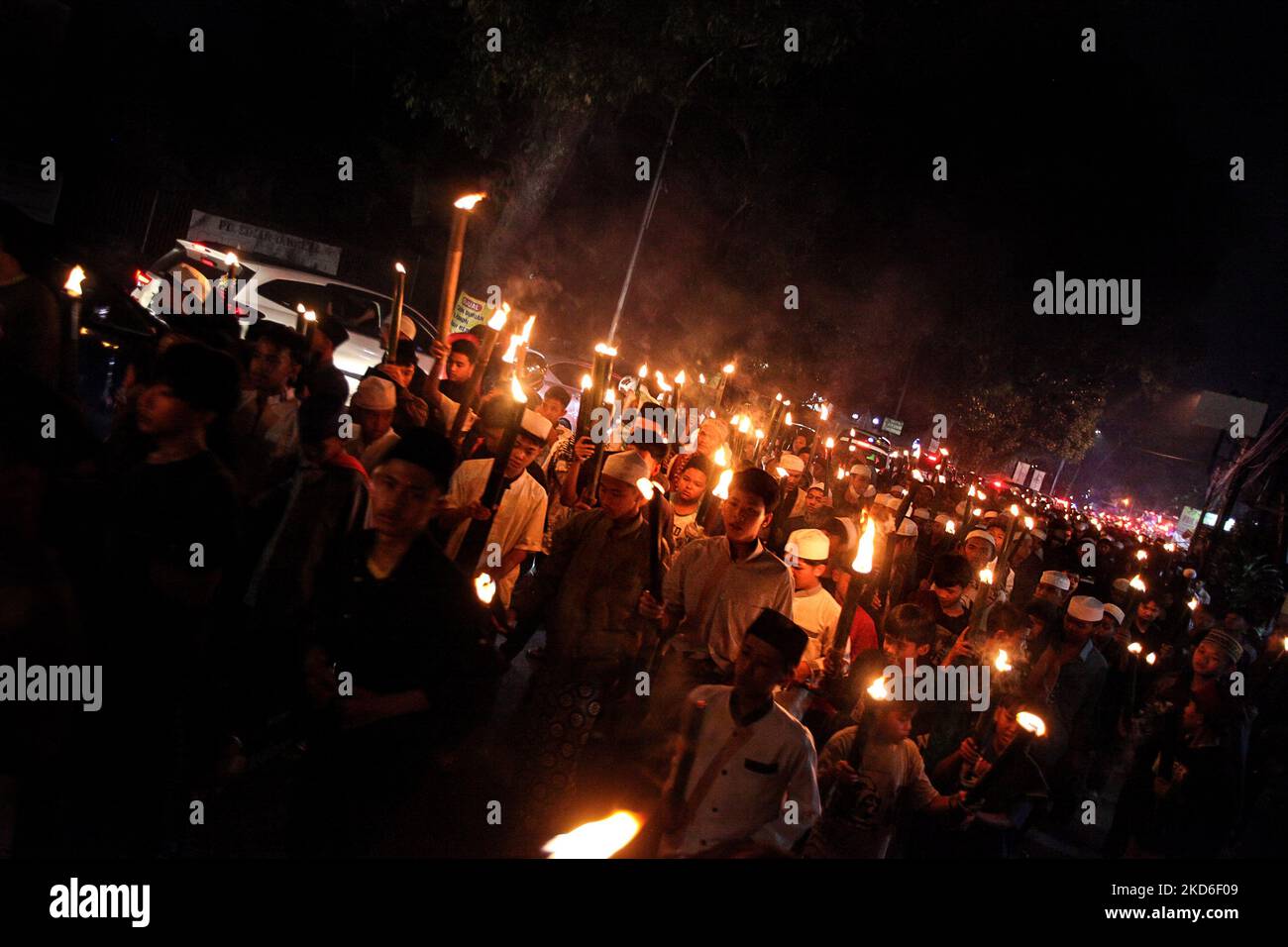 Indonesian Muslim take part in a torch parade to welcome the holy month ...