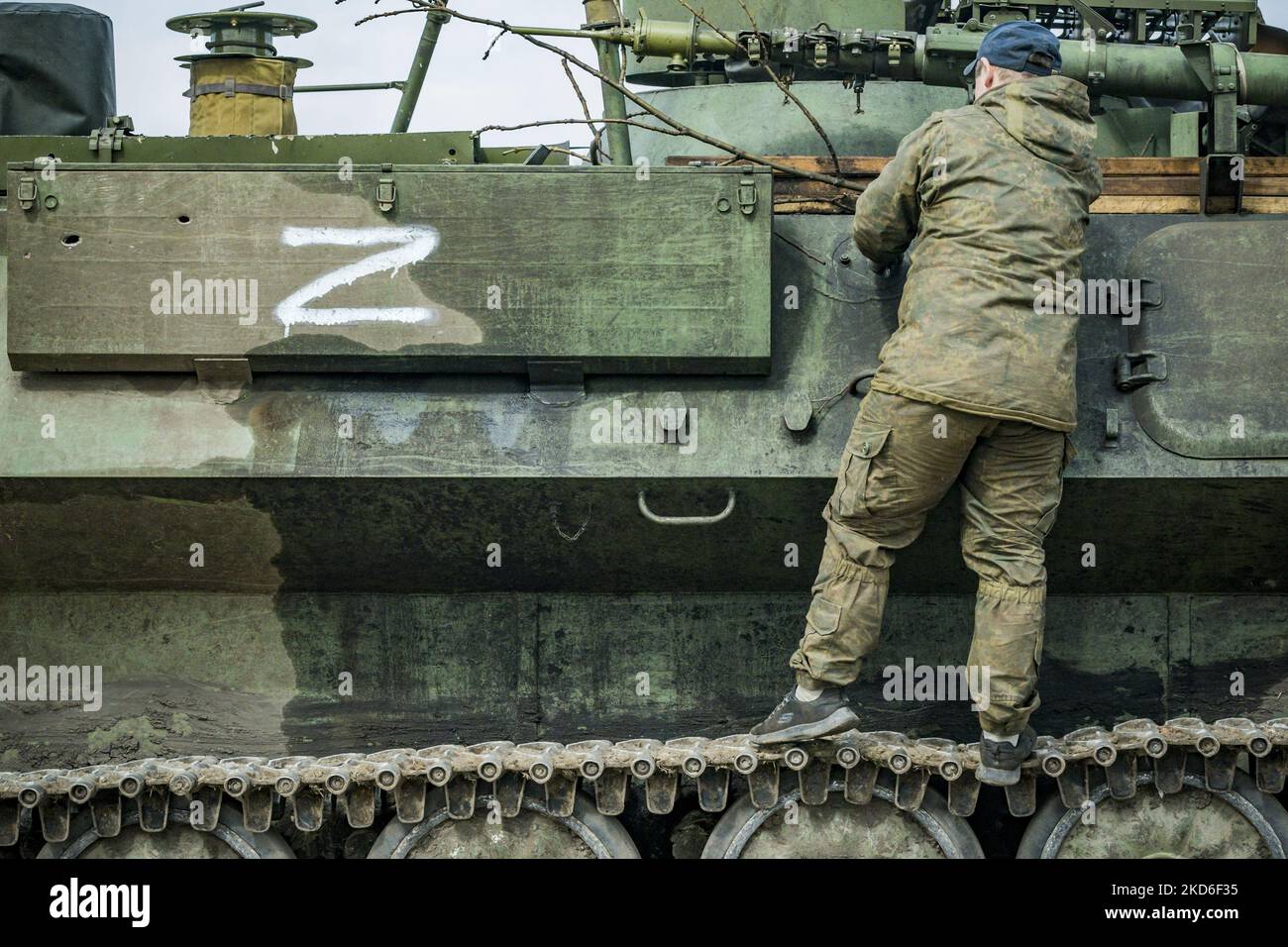 Ukrainian soldier in a captured armored vehicle with the symbol Z of ...
