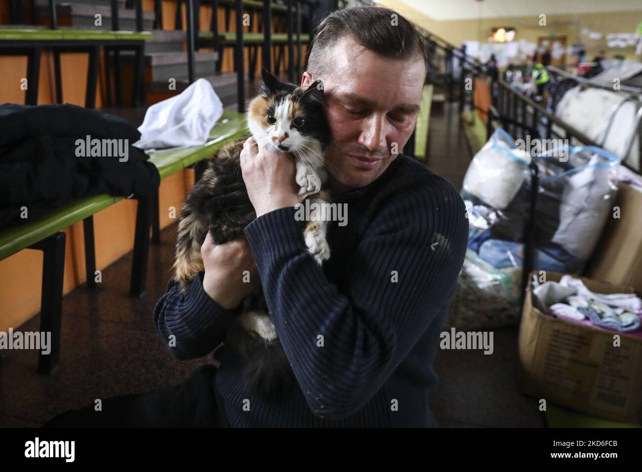 Yaroslav who fled from Mariupol, Ukraine is seen with his cat Alisa at ...