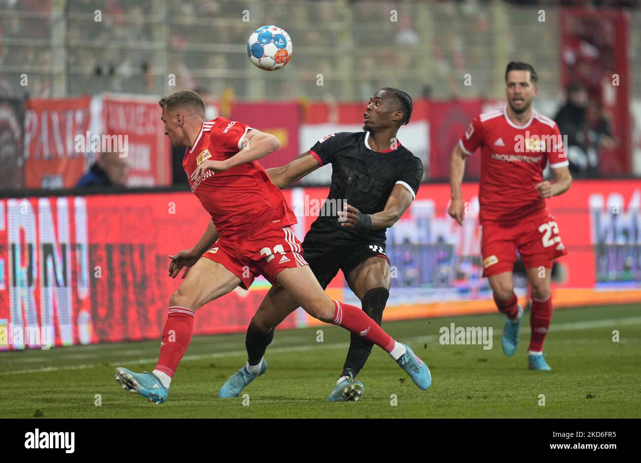 Grischa Promel of Union Berlin battle for the ball with Kingsley ...