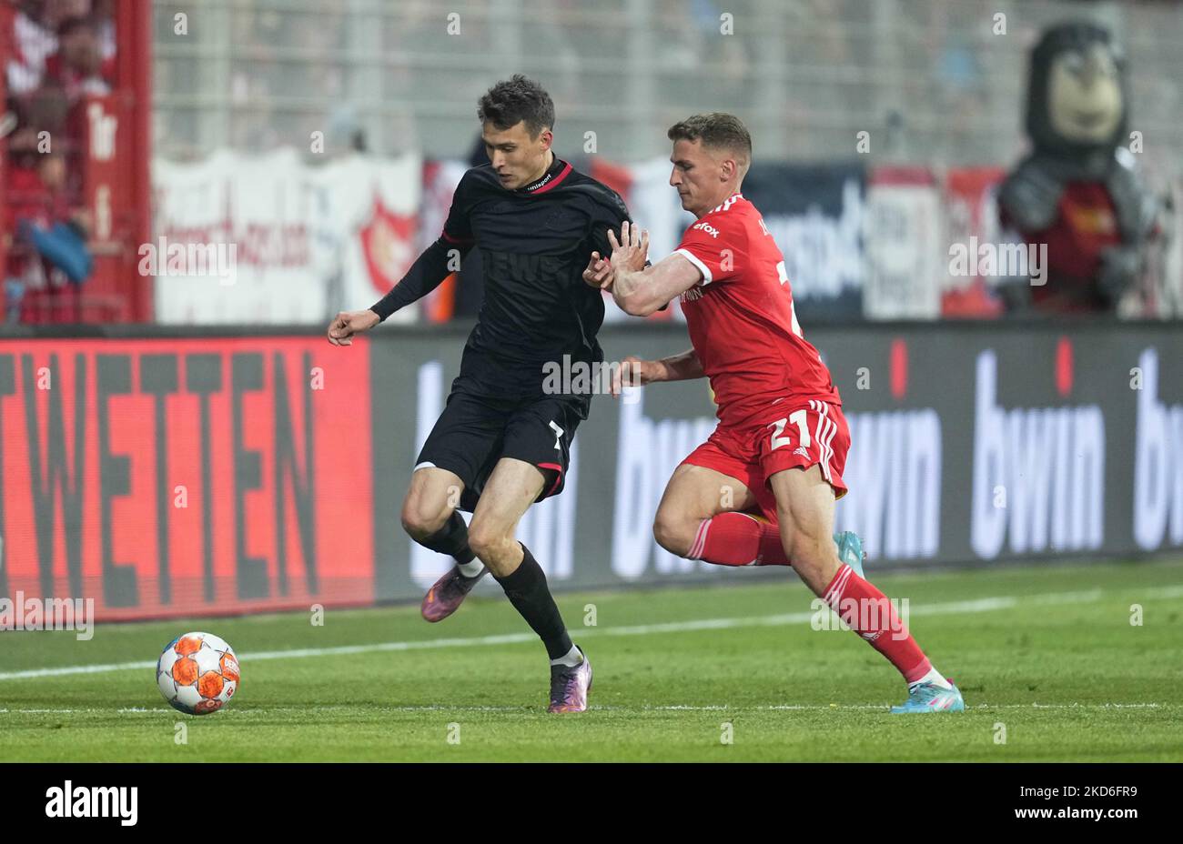 Grischa Promel of Union Berlin battle for the ball with Dejan Ljubicic ...