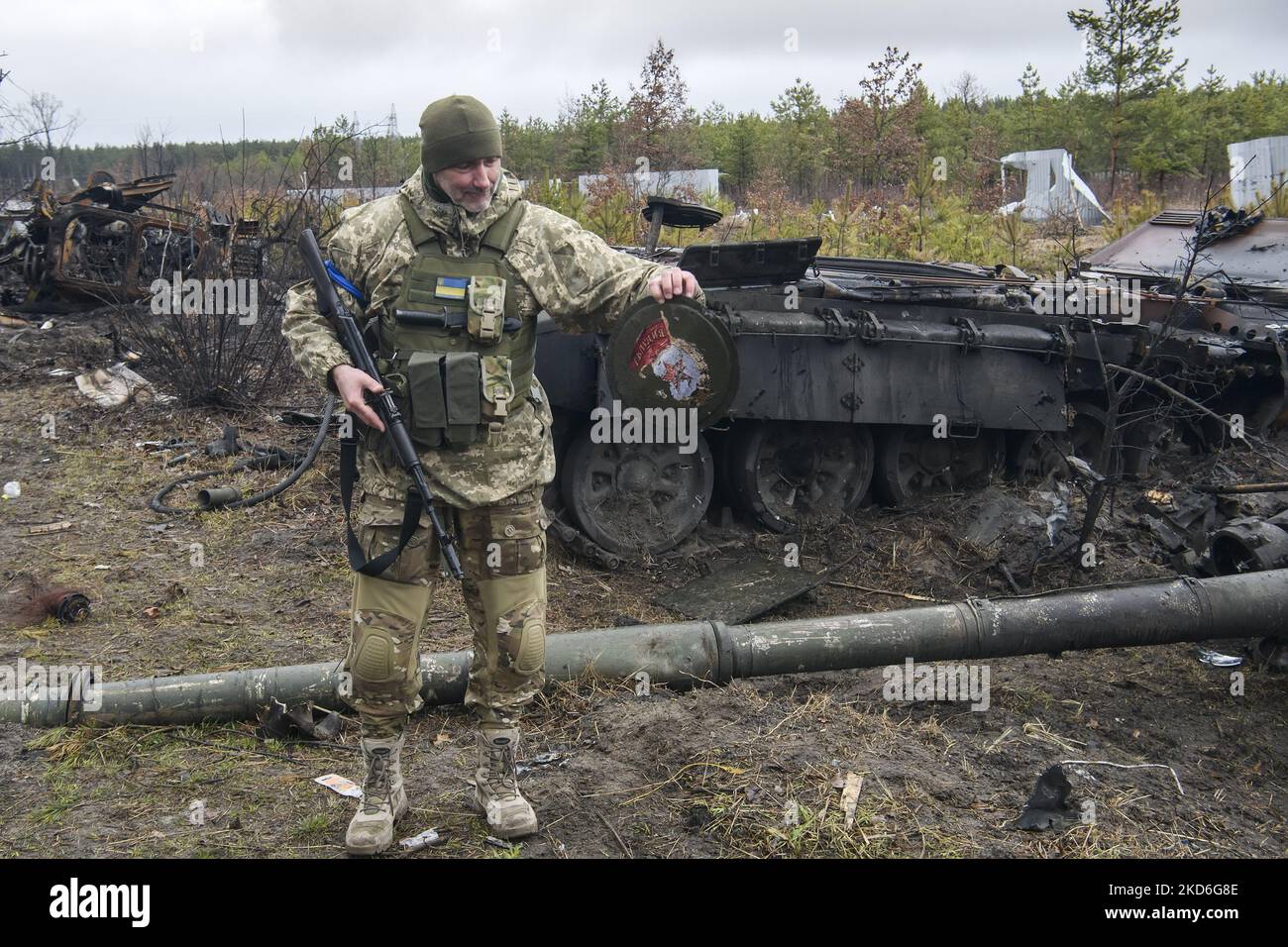 Ukrainian serviceman holds guards sign that found in Destroyed Russian ...