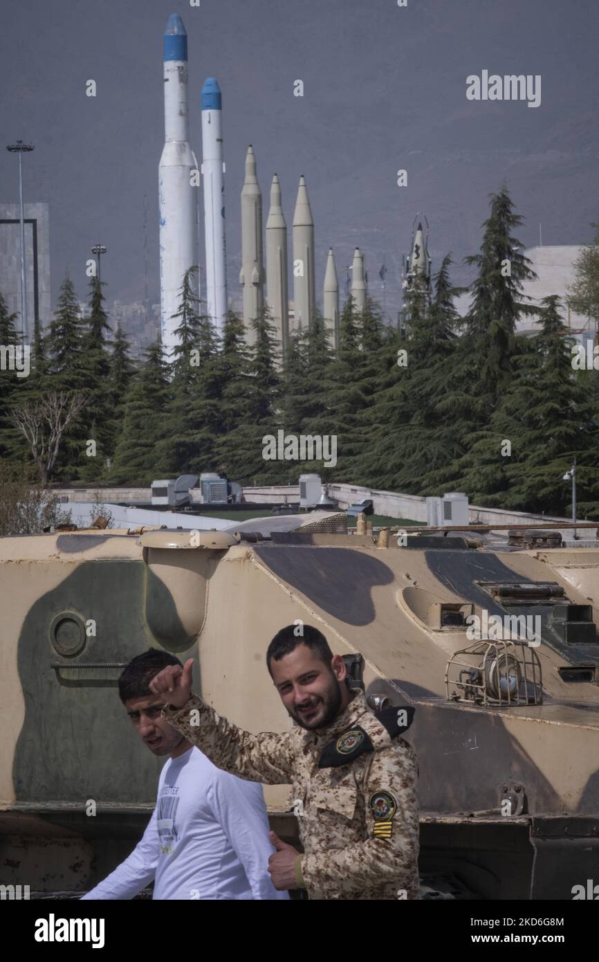 An Iranian military personnel thumbs-up while walking past Iran’s ...