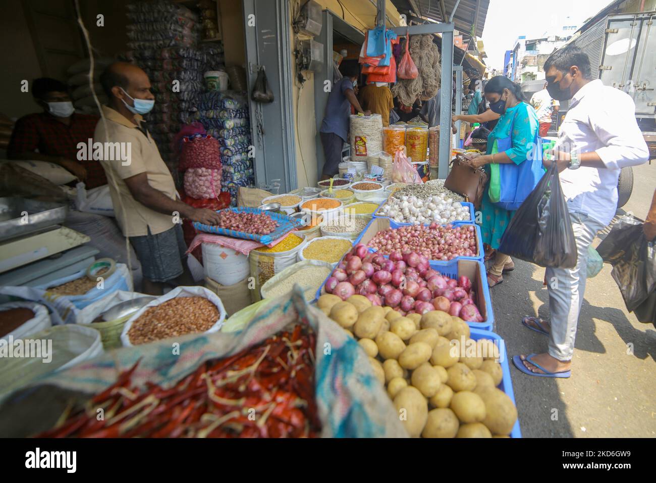 Sri Lankans buy essential food items the main local market at Pettah ...