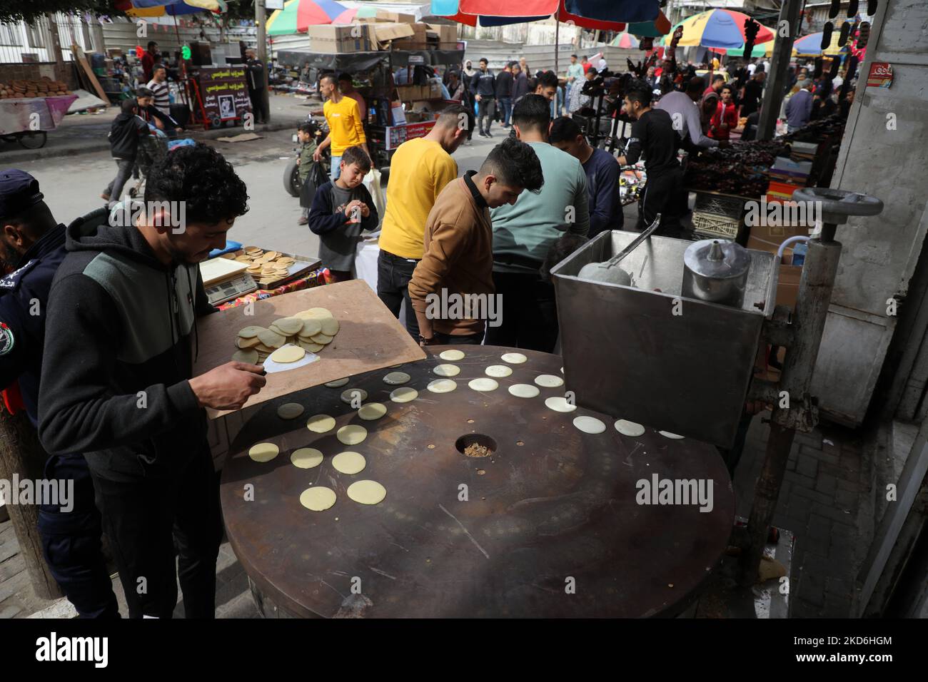 Palestinians prepare traditional "Qatayef" sweets on the first day of ...