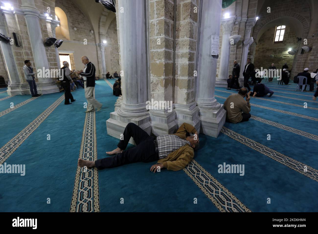 A Palestinian man sleeps at al-Omari mosque on the first day of the ...