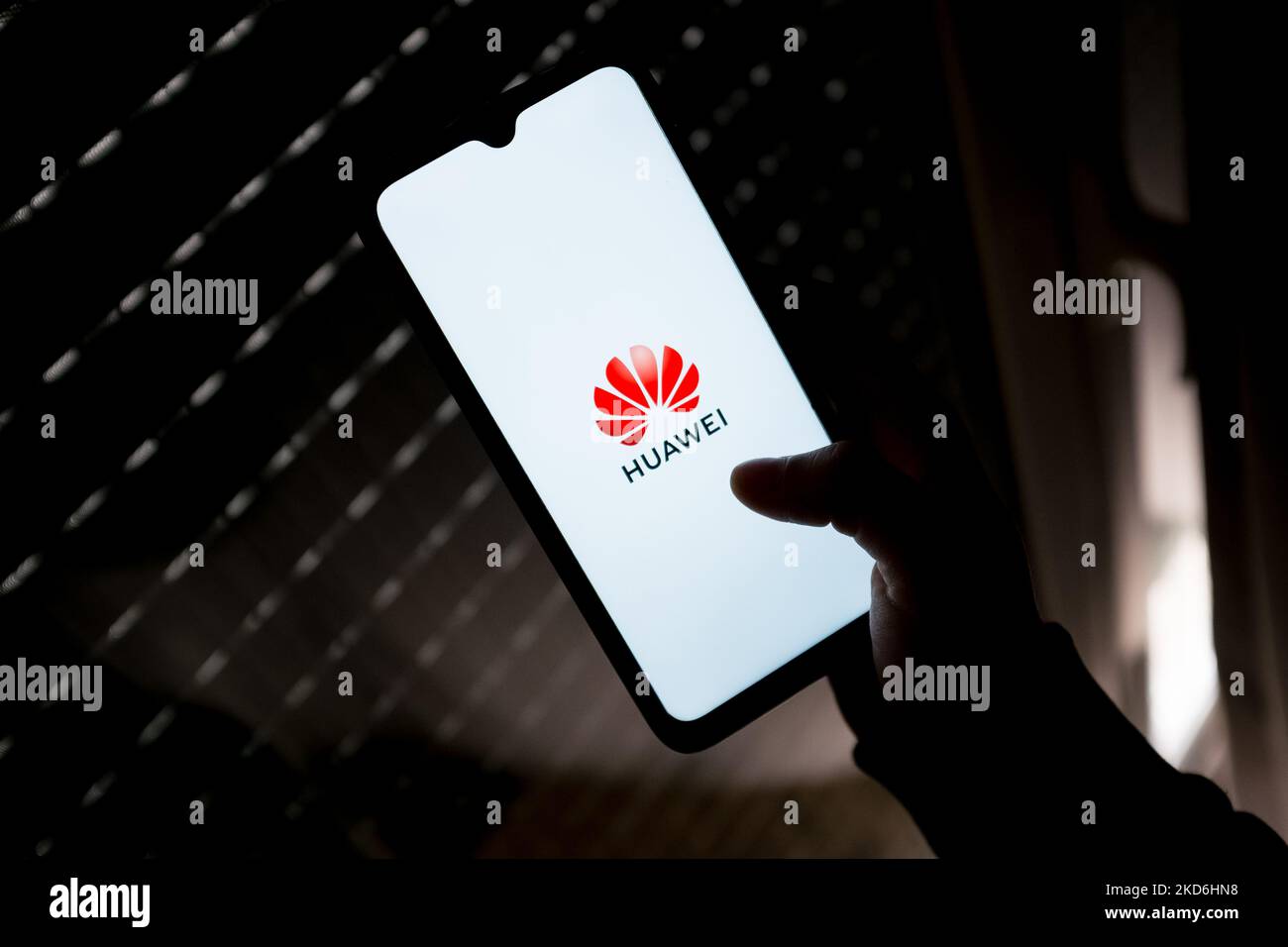 In this photo illustration a Huawei logo seen displayed on a smartphone ...