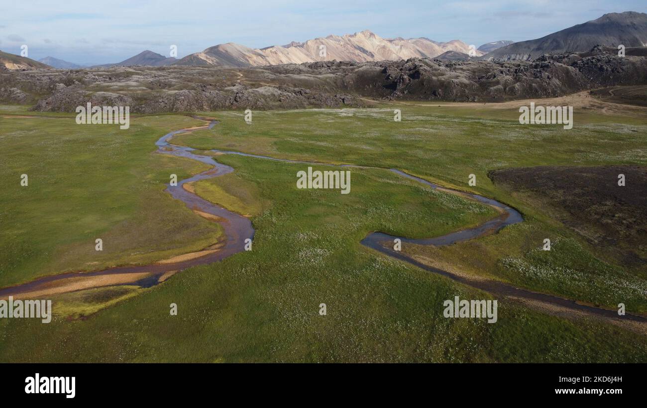 A beautiful shot of two water streams coming from the high mountains in ...