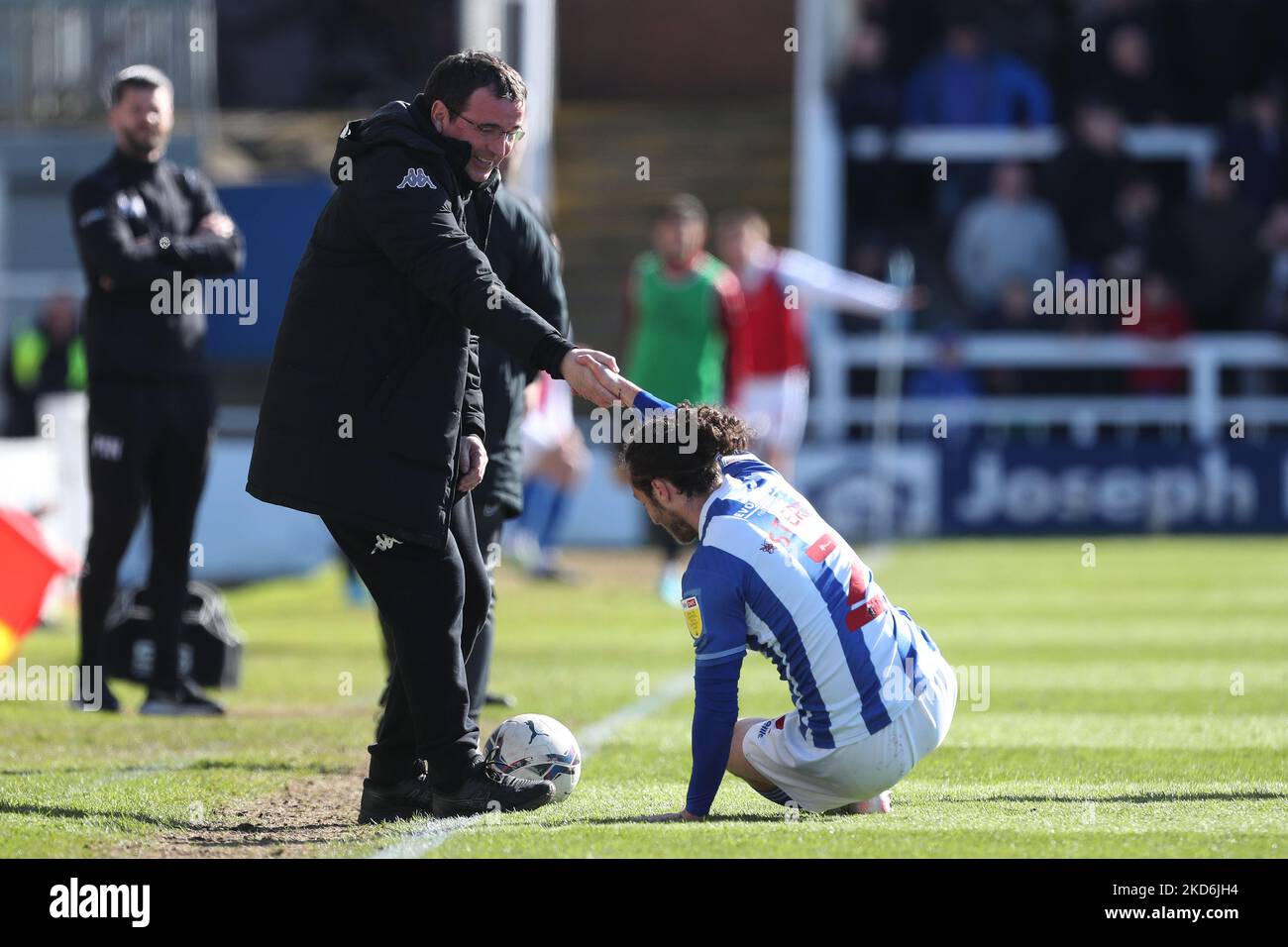 Gary Bowyer the Salfrod City manager helps Hartlepool United's Jamie ...