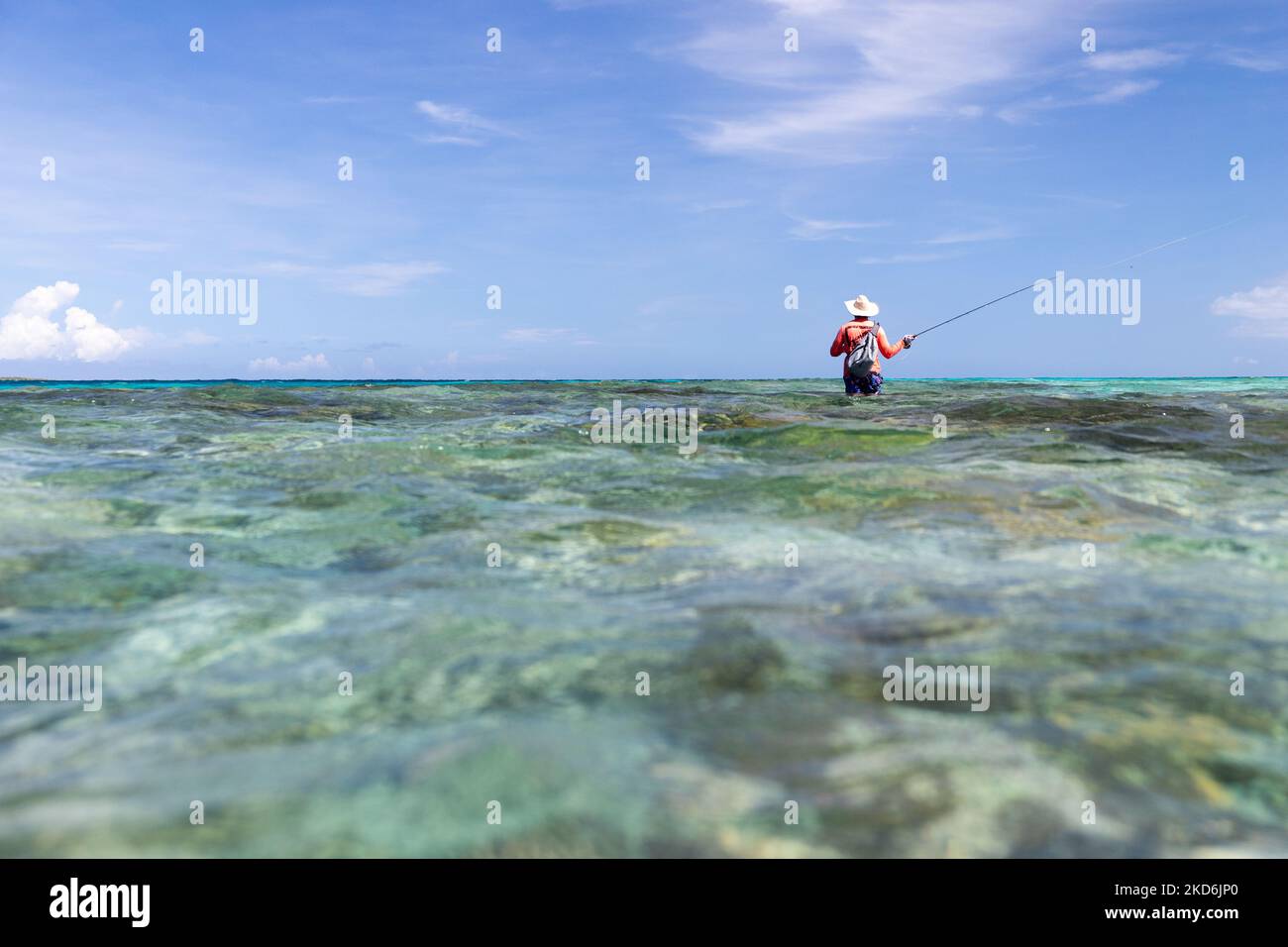 A man fishing in the clear water in White Sand Beach Venezuela Los ...