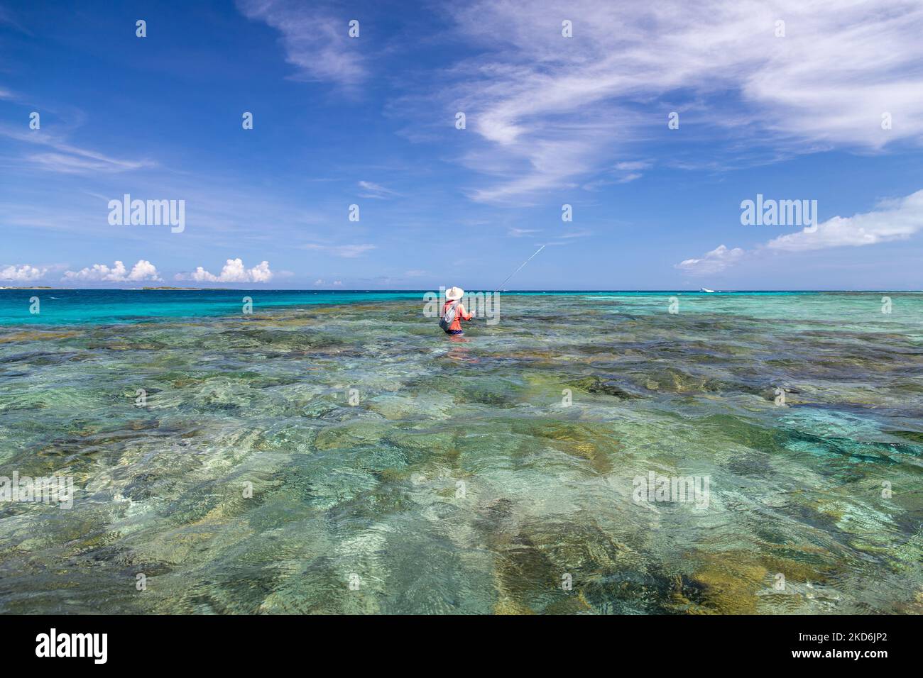 A man fishing in the clear water in White Sand Beach Venezuela Los ...