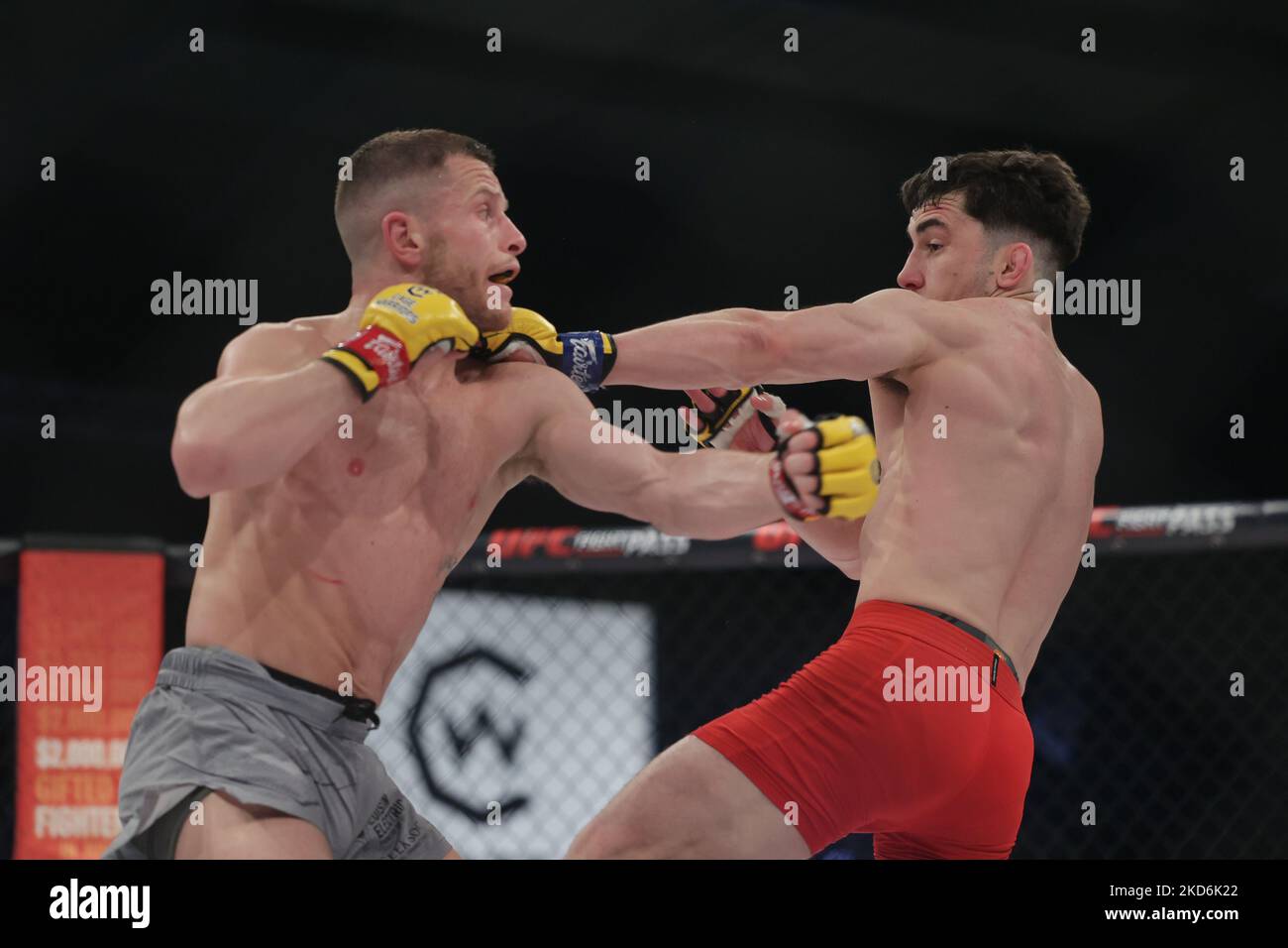 Sam Spencer punches Reece McEwan during the Cage Warriors 136 event at ...