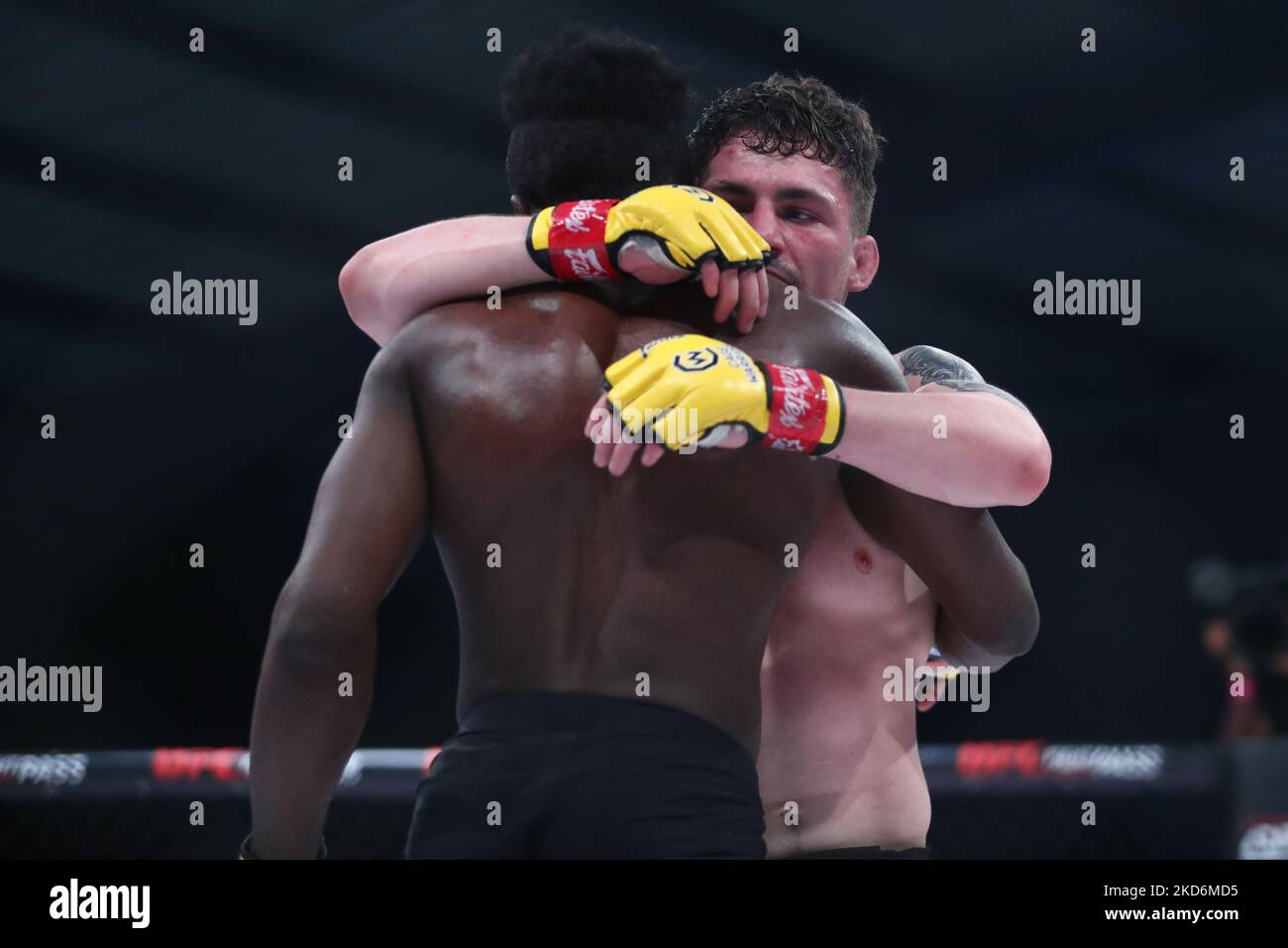 Edward Walls (left) and Liam Gittins (right) share an embrace following ...