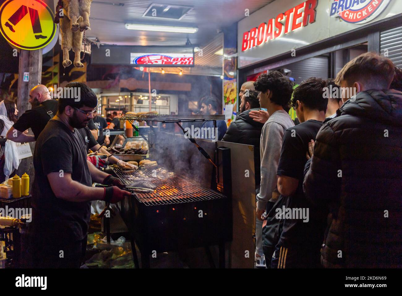 People attend a street fair at night after Iftar, or breaking the day's ...