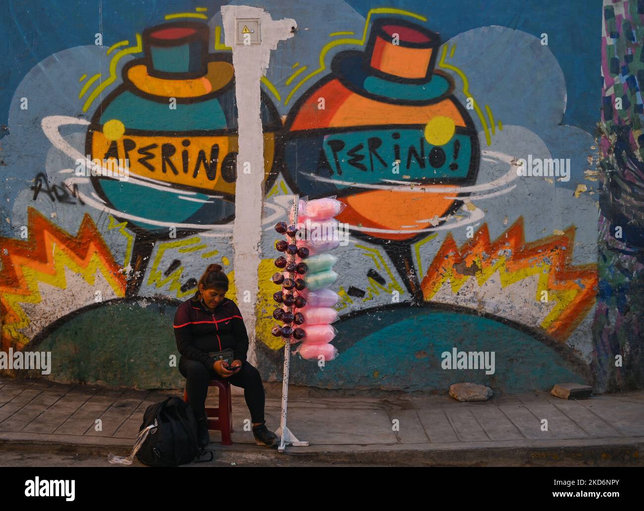 Cotton candy vendor in the Alameda Chabuca Granda, a busy wide ...