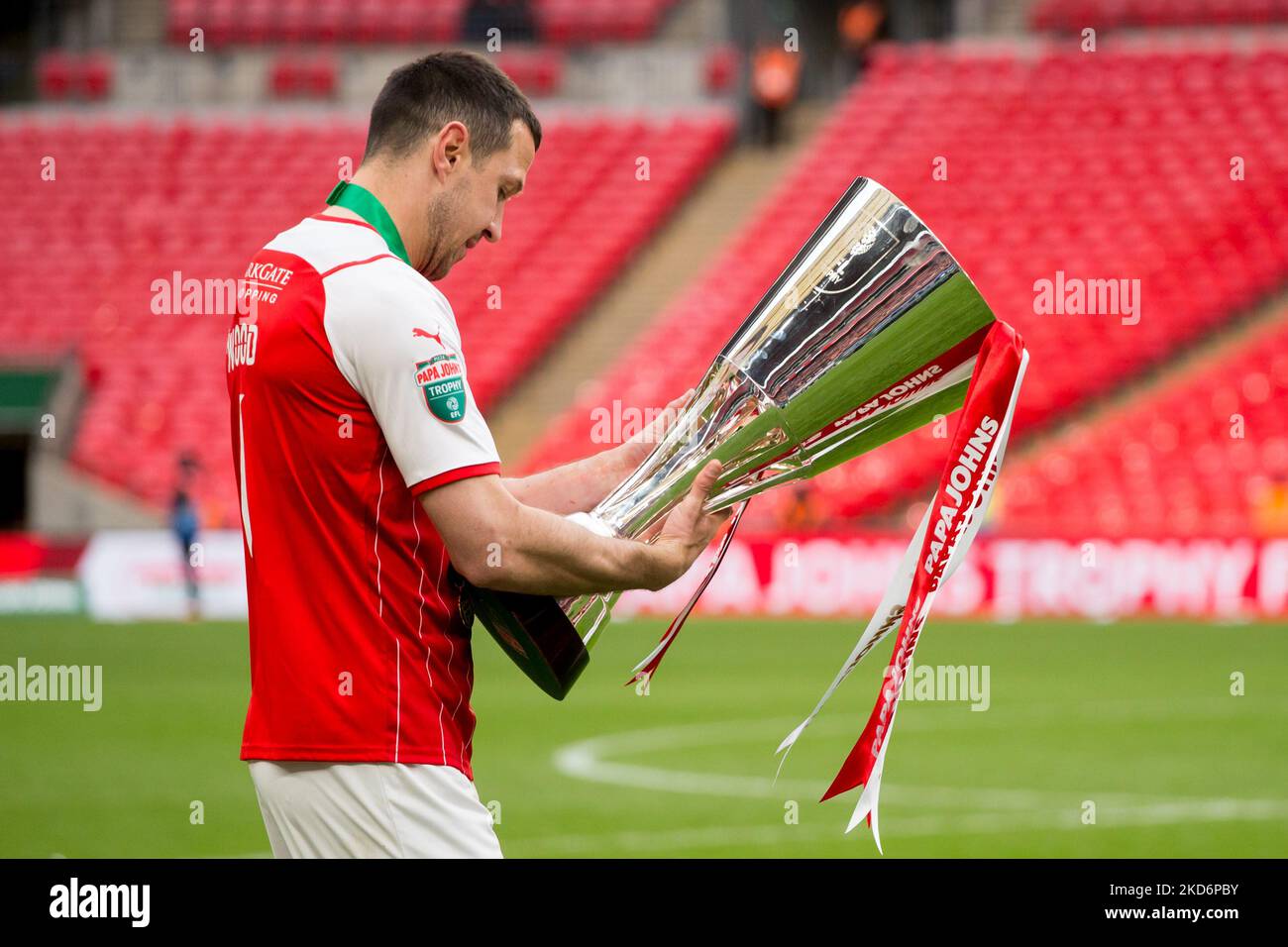 Richard Wood of Rotherham United looks the trophy during the Papa John ...
