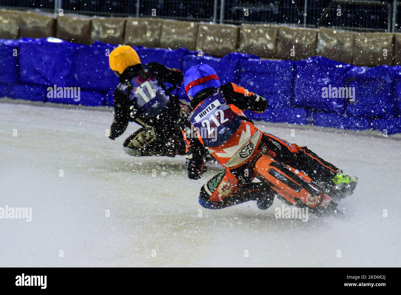 Lukas Hutla (212) chases Henri Ahlbom (17) during the FIM Ice Speedway ...