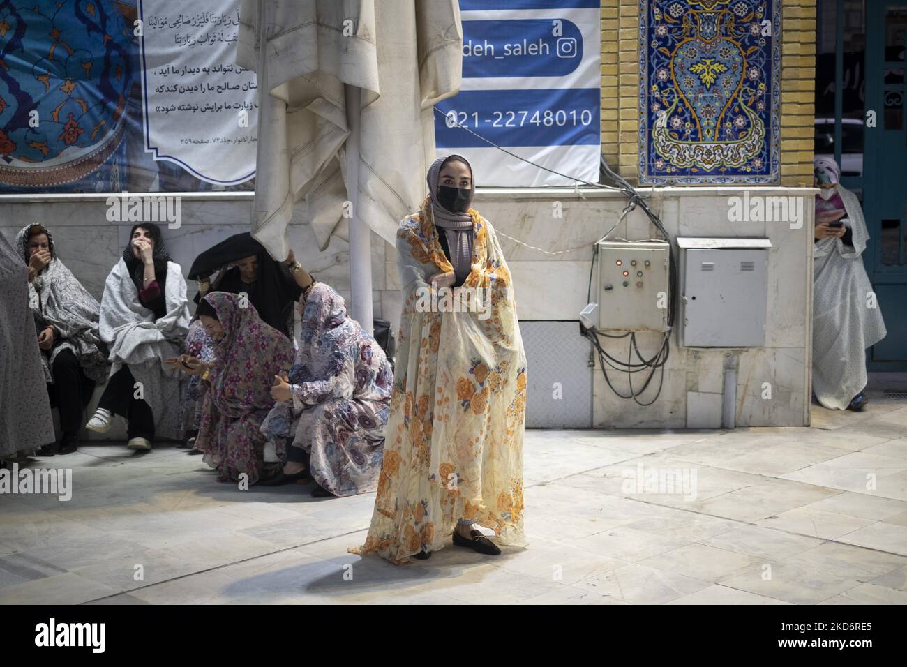 An Iranian veiled woman in a colorful chador (Islamic dressing code ...