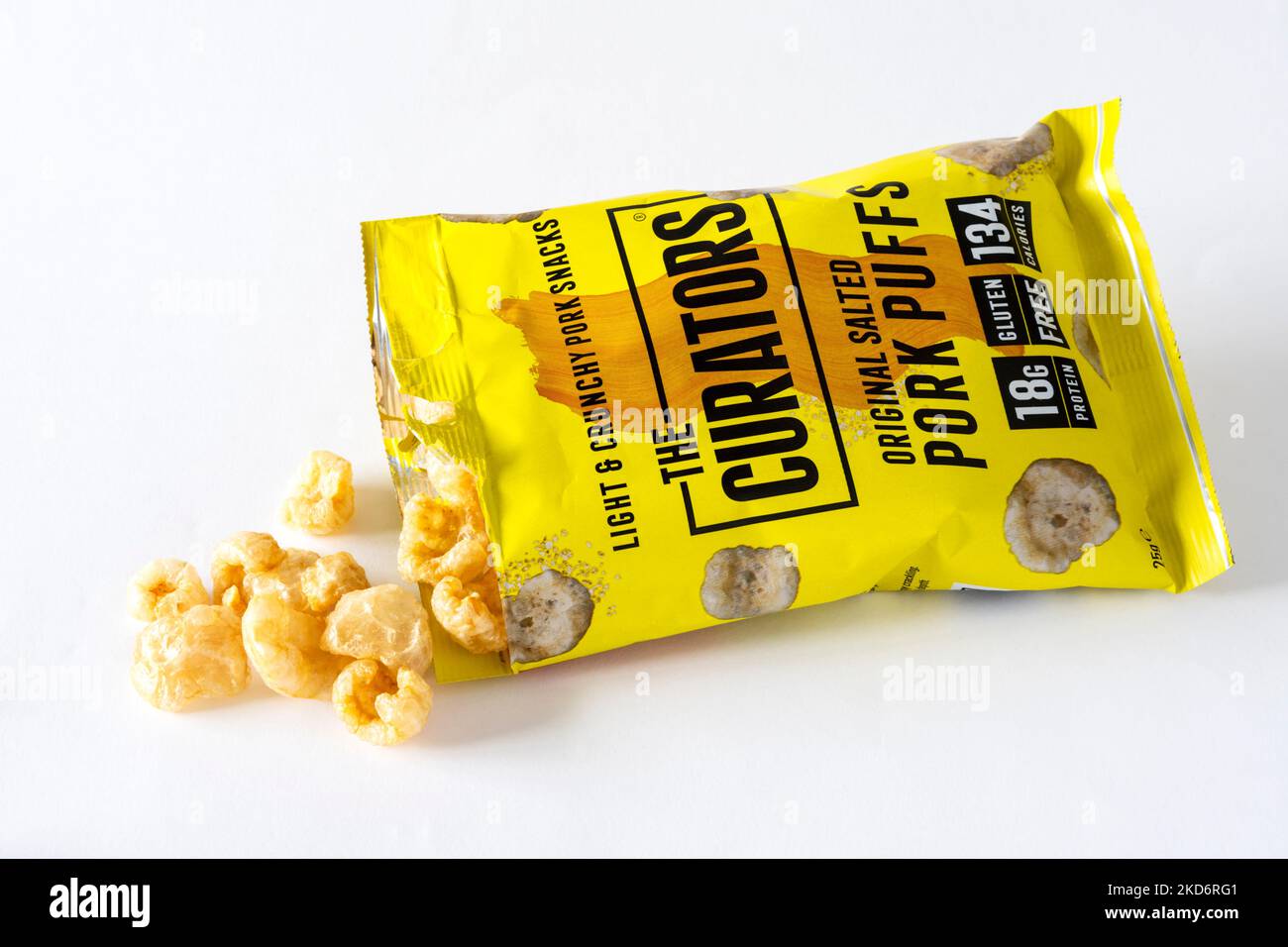 An open bag of The Curators original salted Pork Puffs Stock Photo - Alamy