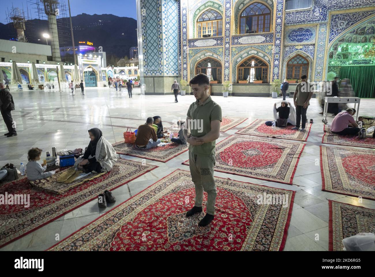 A sunni man prays at a holy shrine in northern Tehran at the end of the ...