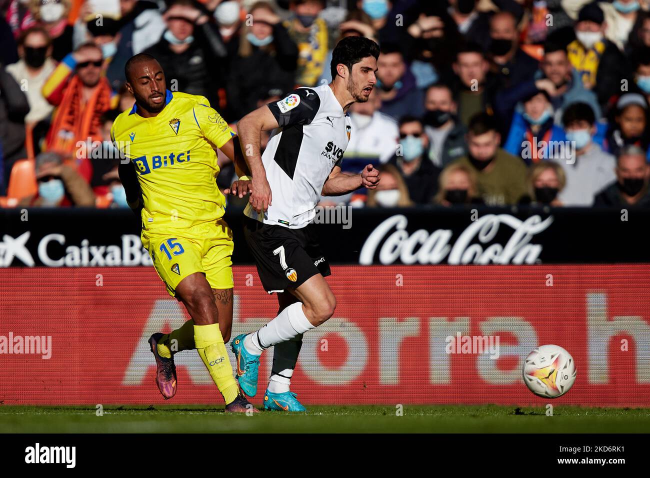 Goncalo Guedes (R) of Valencia CF competes for the ball with Akapo of ...