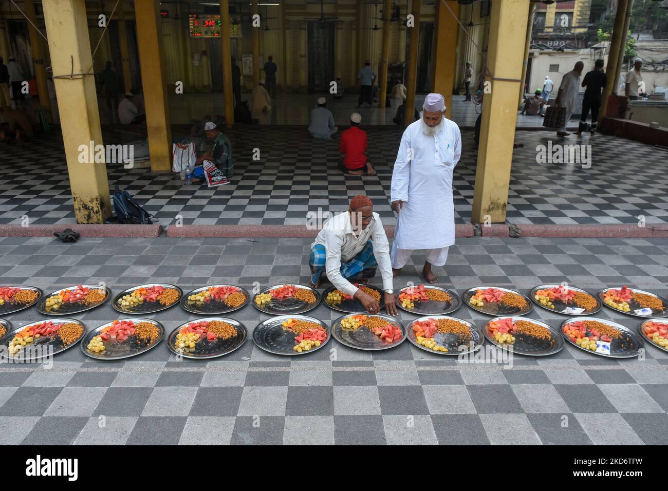 A man is seen preparing iftar meal to break the fast on the second day ...