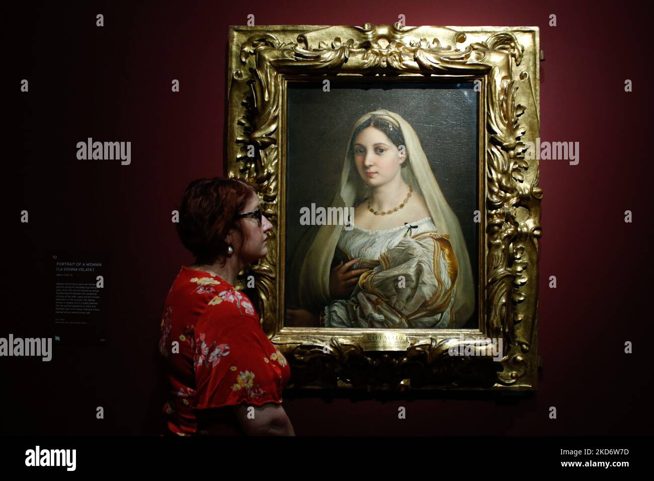 A gallery employee poses with oil on canvas painting 'Portrait Of A ...