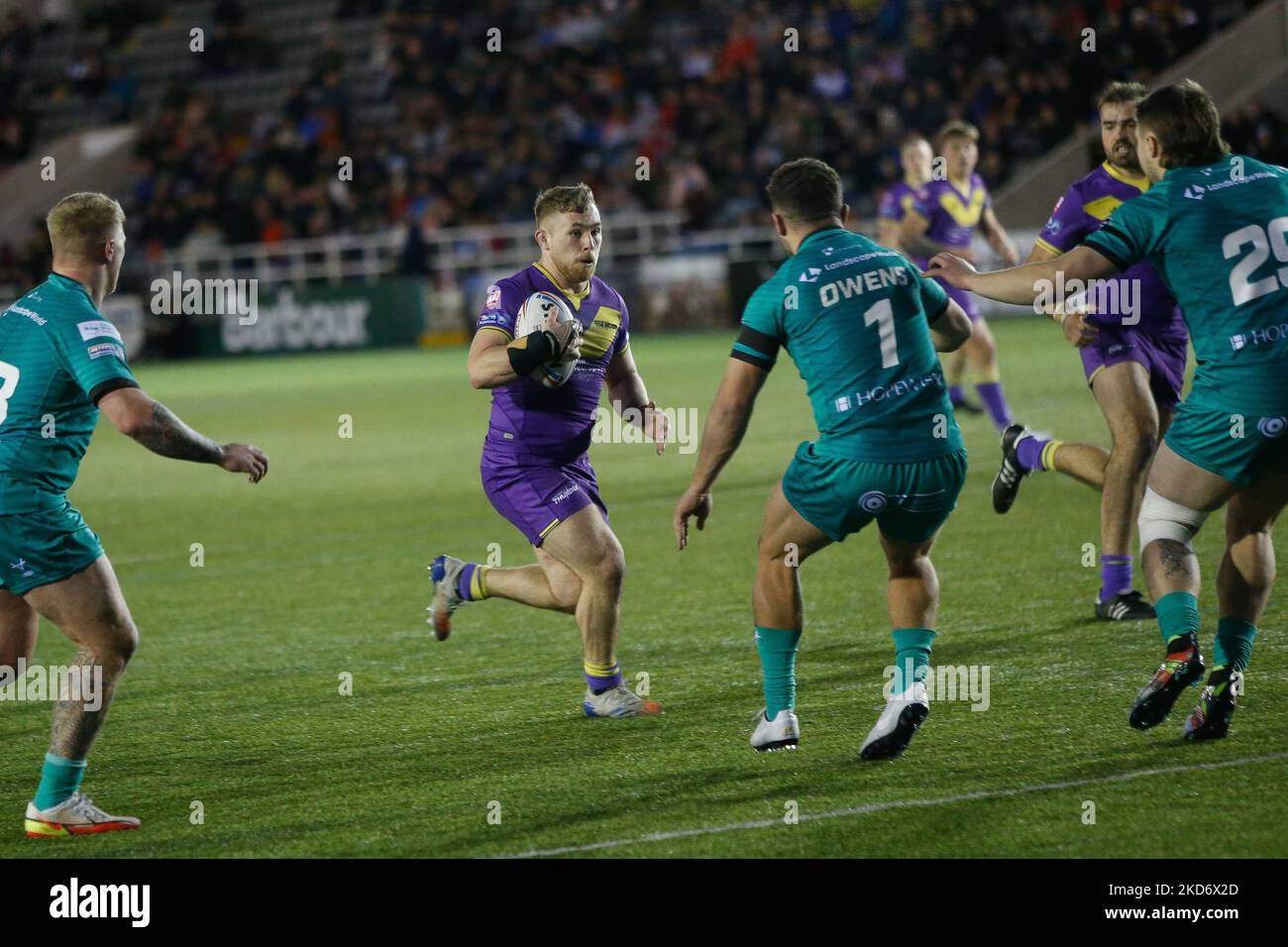 Sam Hallas of Newcastle Thunder has a run at Jack Owens of Widnes ...