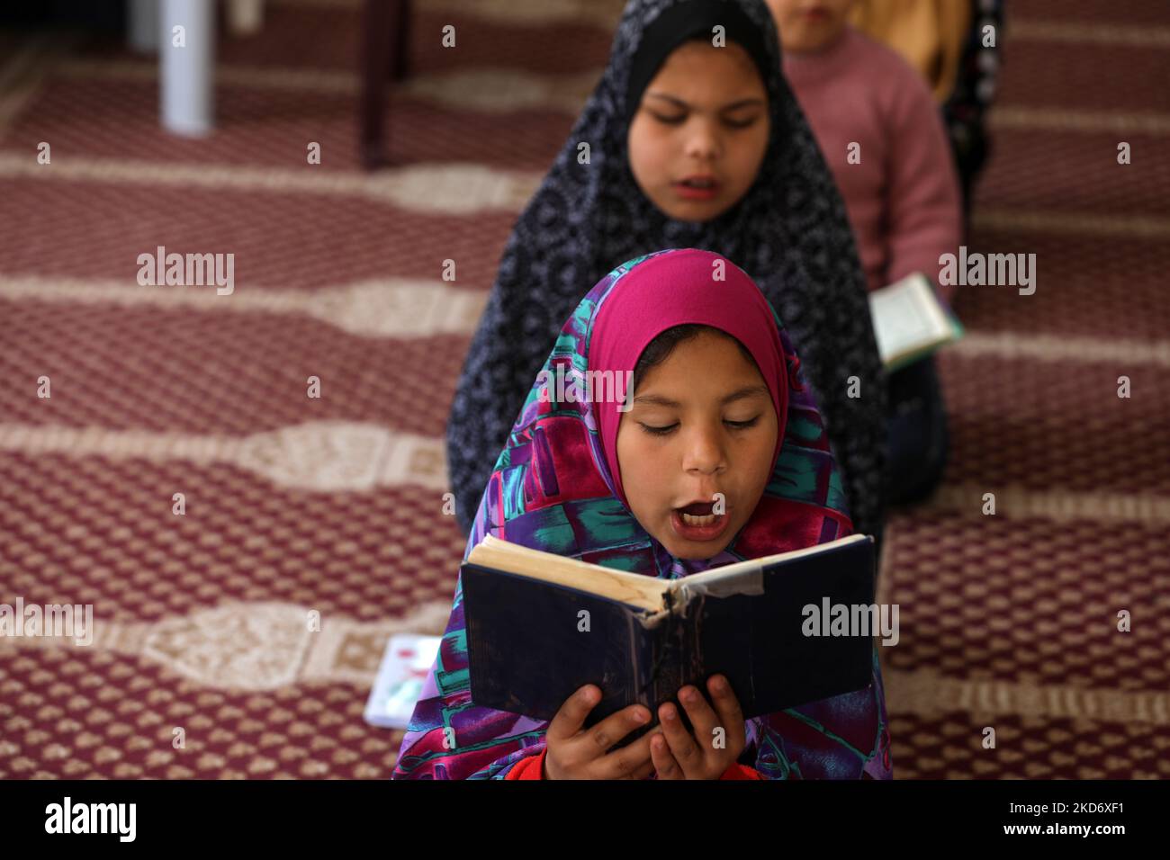 Palestinian girls study the holy Quran at a mosque during the Muslim ...