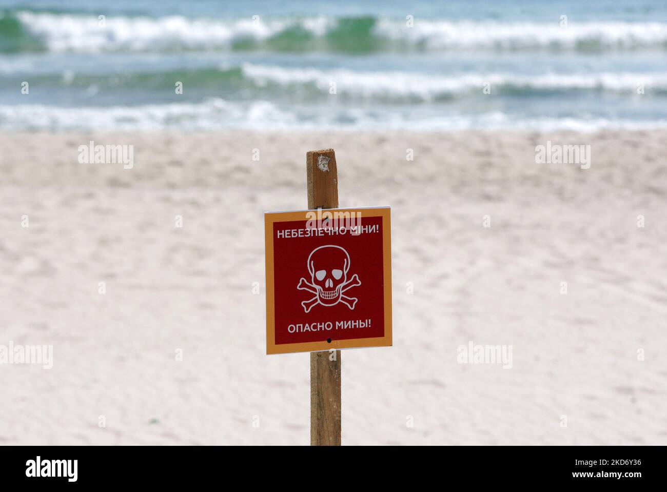 "Dangerous mines!" is written on a warning sign at a beach of the city ...
