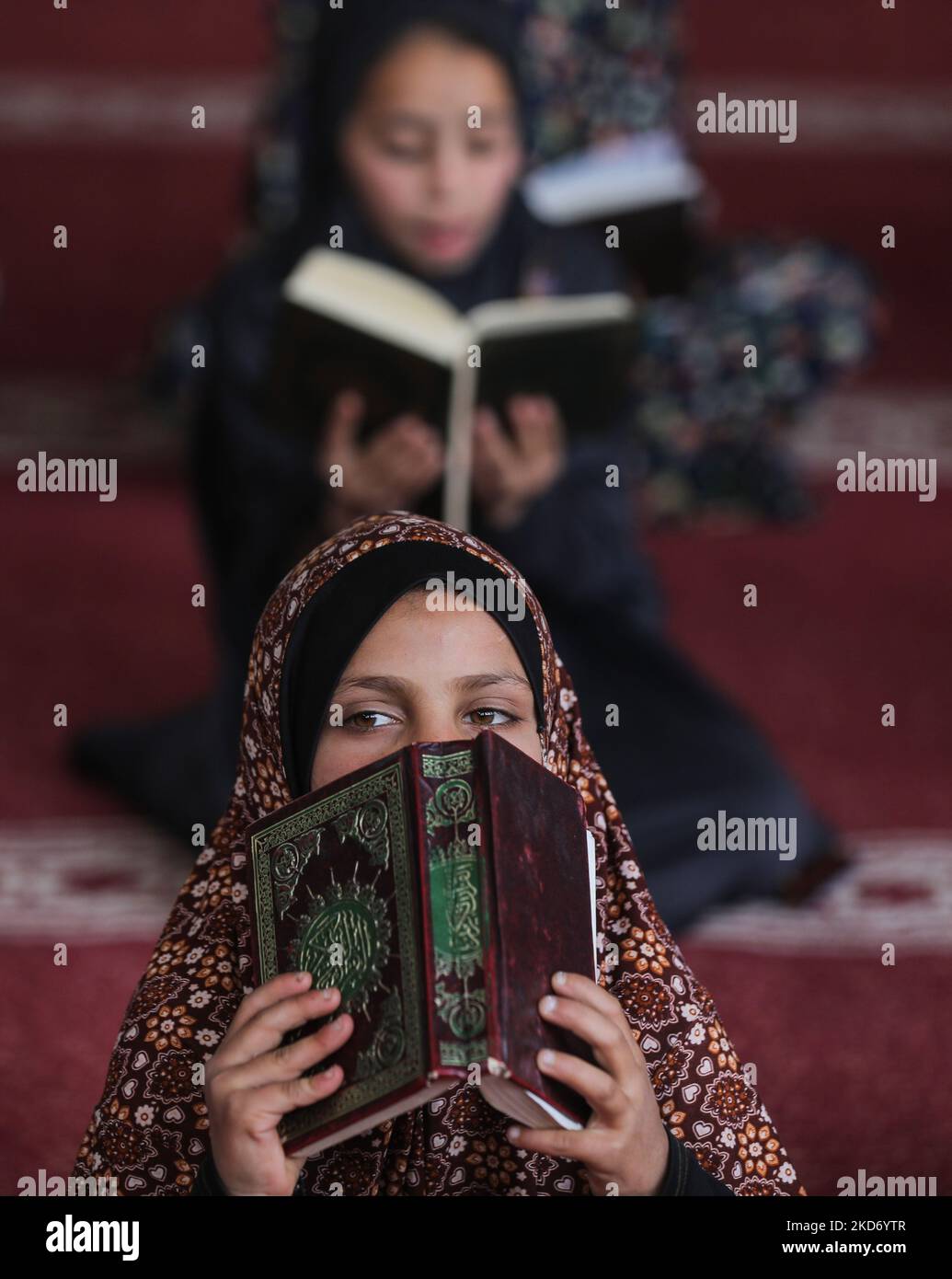 Palestinian girls study the holy Quran at a mosque during the Muslim ...