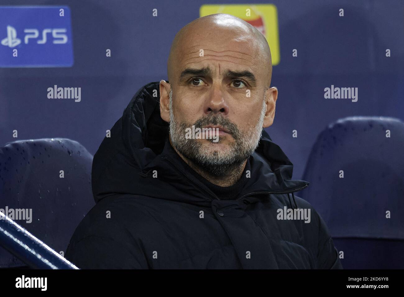 Pep Guardiola head coach of Manchester City sitting on the bench during ...