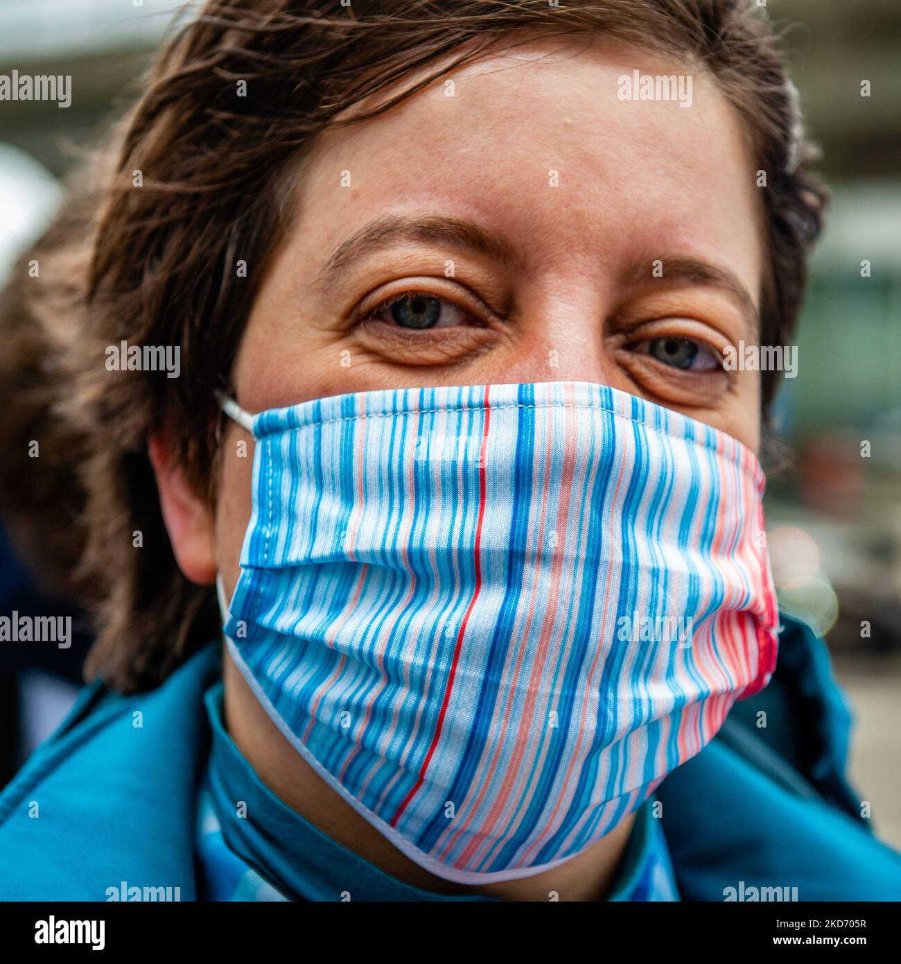 A scientist is wearing a mouth mask with the global warming chart on it ...