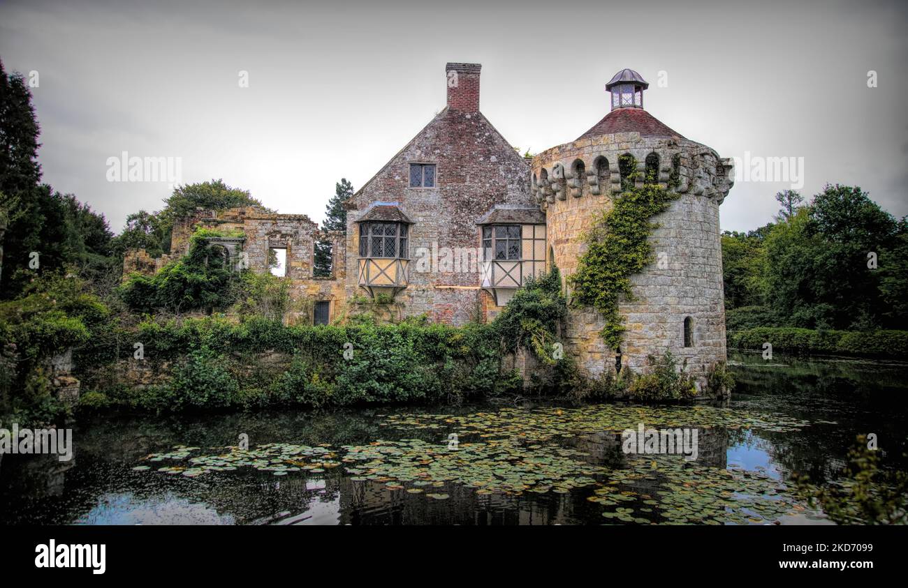 The beautiful exterior of the historic Scotney Castle surrounded by ...