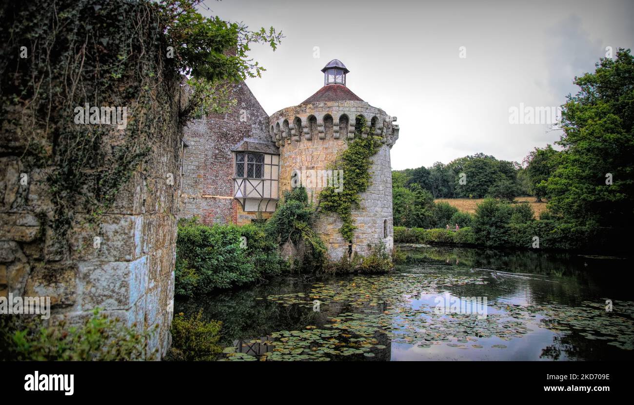 The beautiful exterior of the historic Scotney Castle surrounded by ...