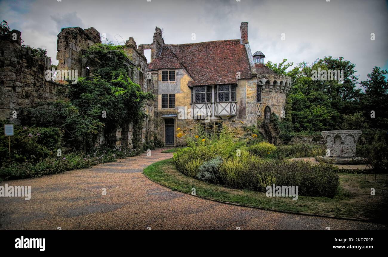 The beautiful exterior of the historic Scotney Castle surrounded by ...