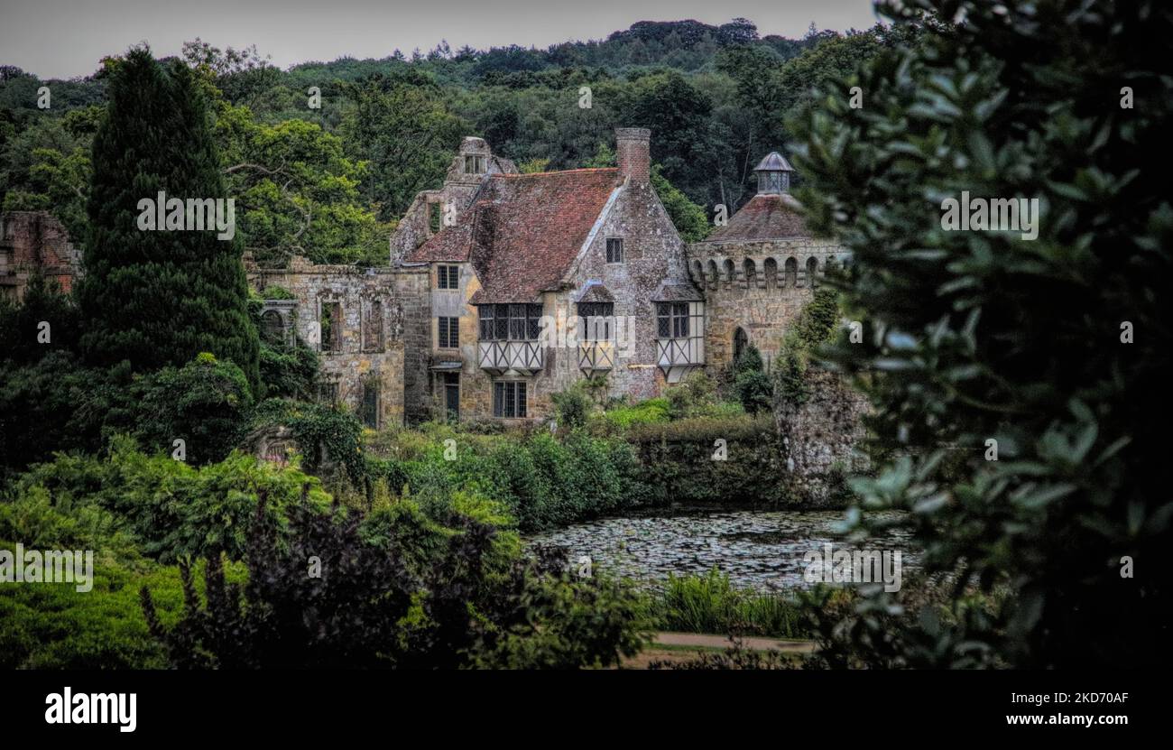 The beautiful exterior of the historic Scotney Castle surrounded by ...