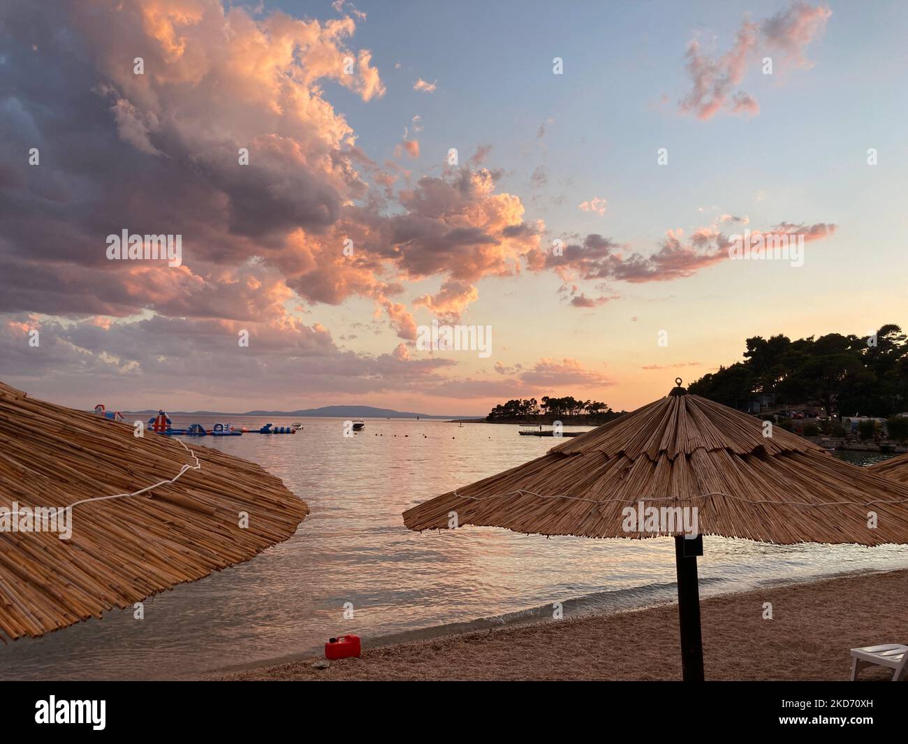 A beautiful seascape at soft pink sunset Stock Photo - Alamy