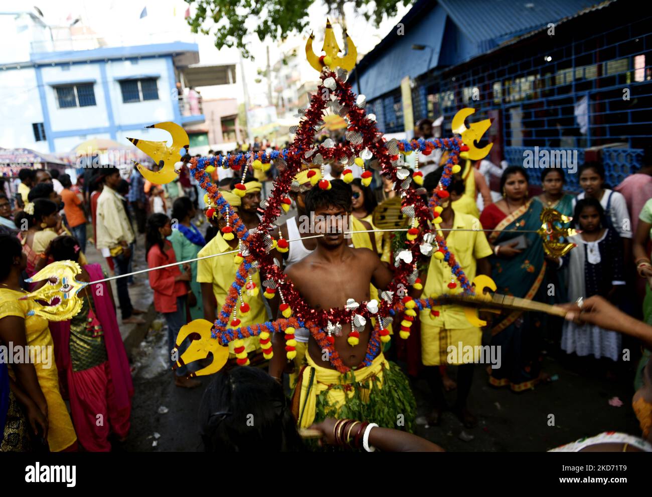 A devotee pierce his skin during a religious procession to mark Bhel ...