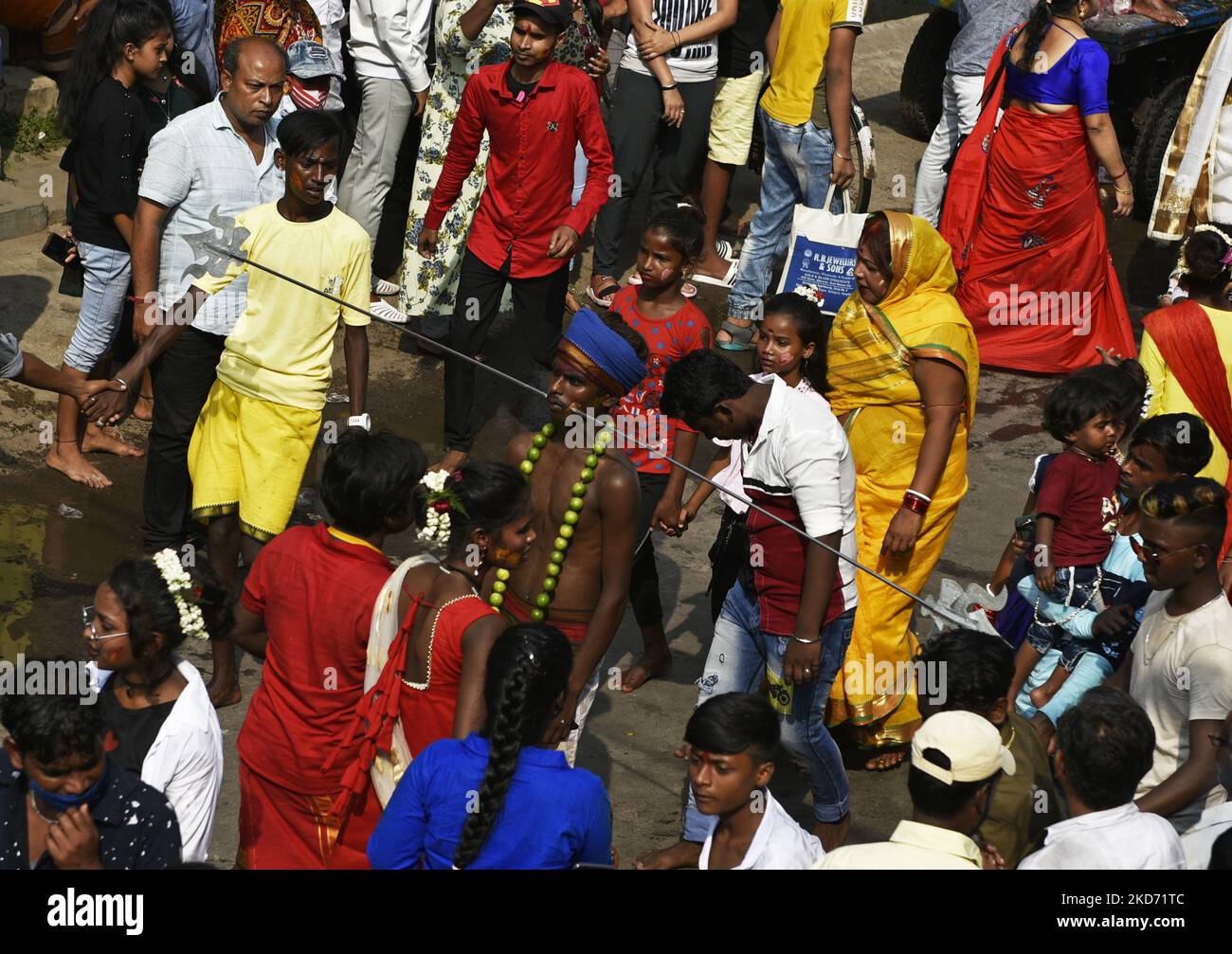 A devotee pierce his skin during a religious procession to mark Bhel ...