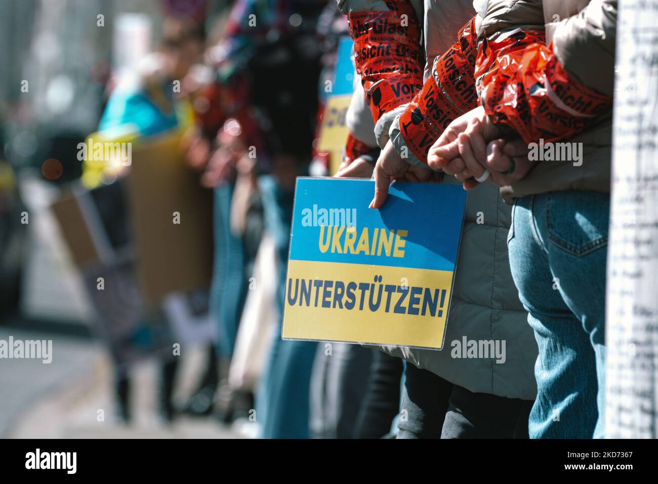 protesters are seen with hands tied behind her back during the protest ...