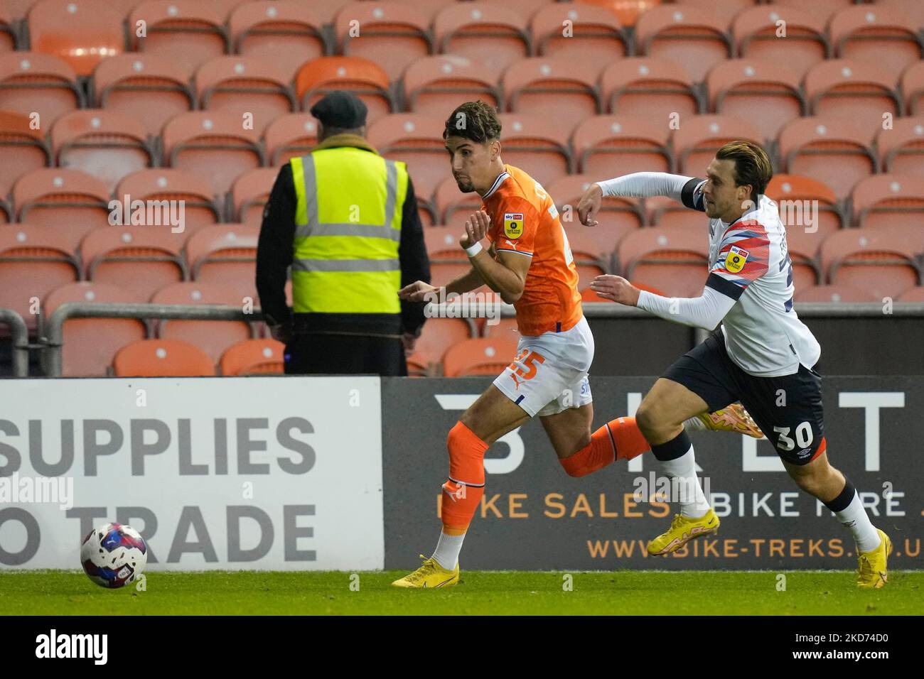 Theo Corbeanu #25 of Blackpool breaks past Luke Freeman #30 of Luton ...