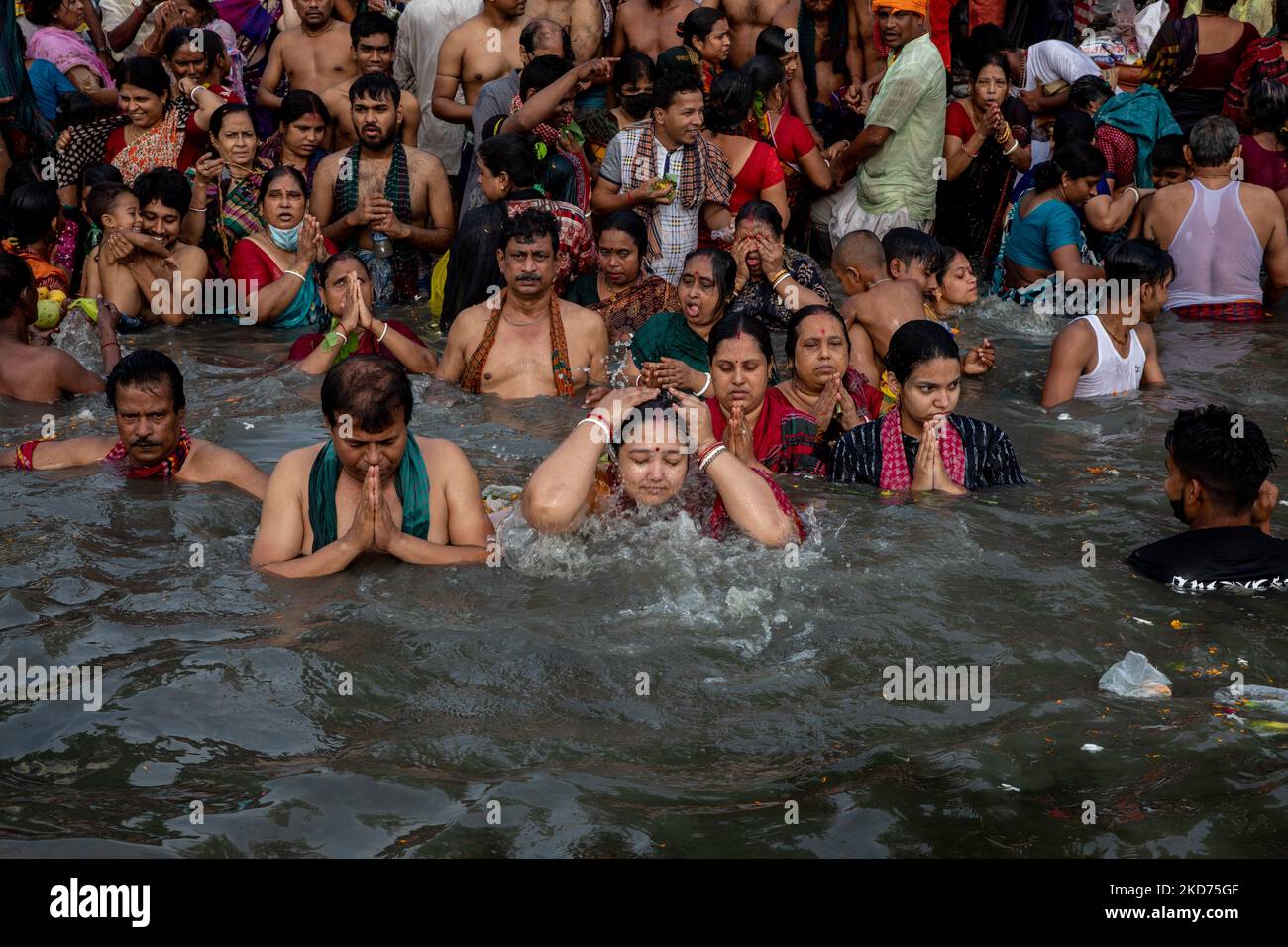 Bangladeshi Hindu devotees take a holy bath and pray in the Brahmputra ...