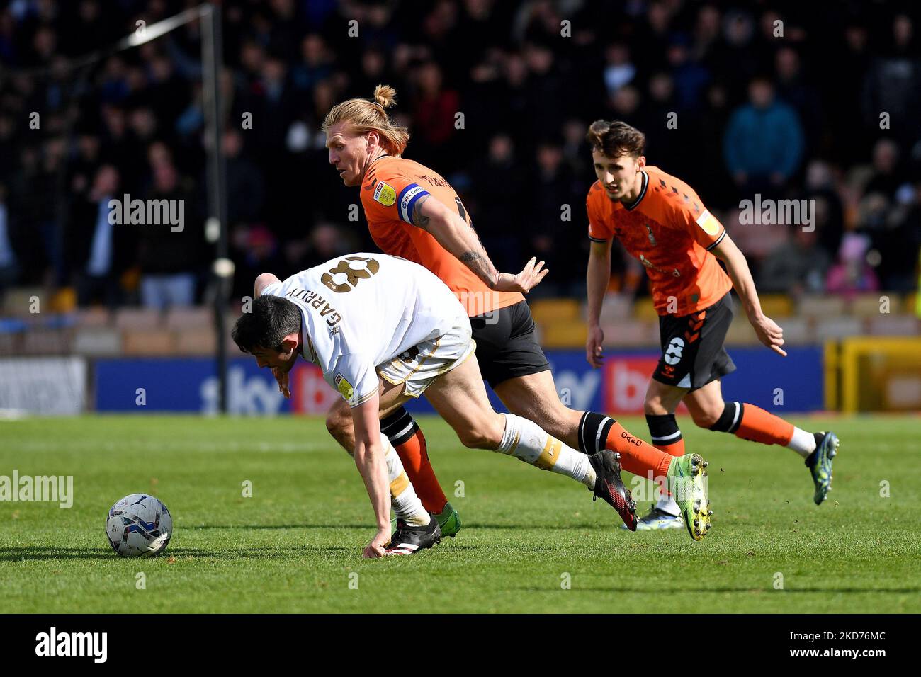 Oldham Athletic's Carl Piergianni tussles with Ben Garrity of Port Vale ...