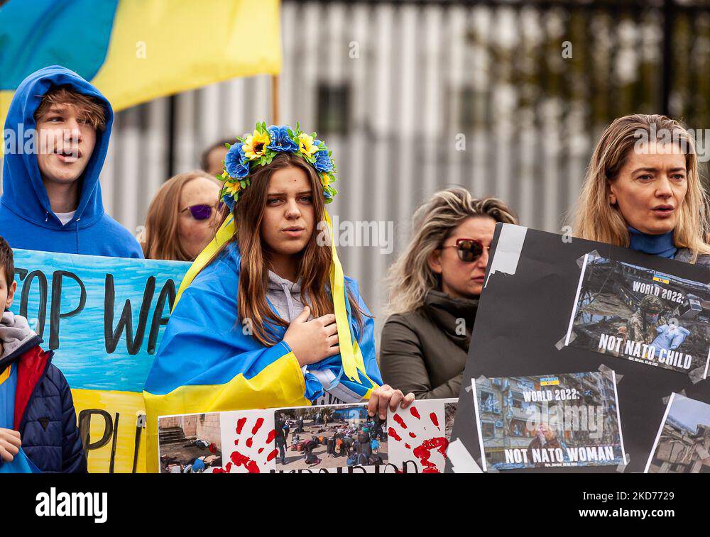 Protesters sing the Ukrainian national anthem during a rally at the ...