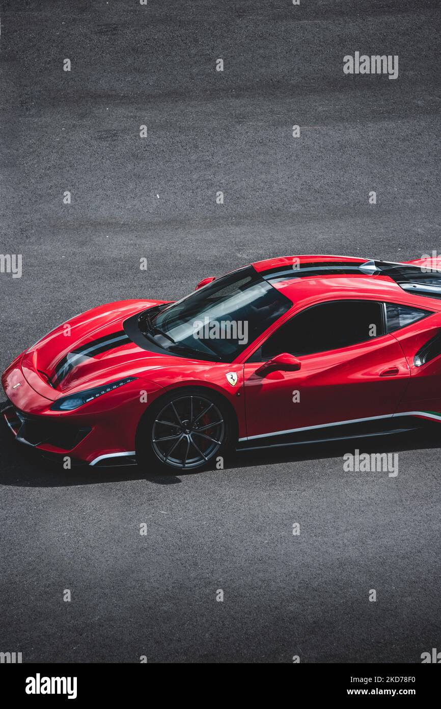A vertical shot of a red Ferrari 488 on the road in Chesterfield Stock ...