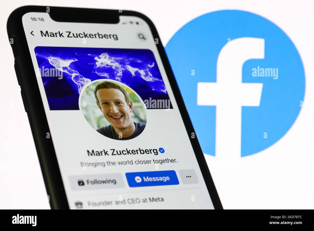Mark Zuckerberg's Facebook profile displayed on a phone screen and ...