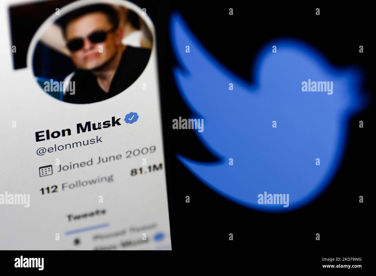 Elon Musk's Twitter profile displayed on a computer screen and Twitter ...